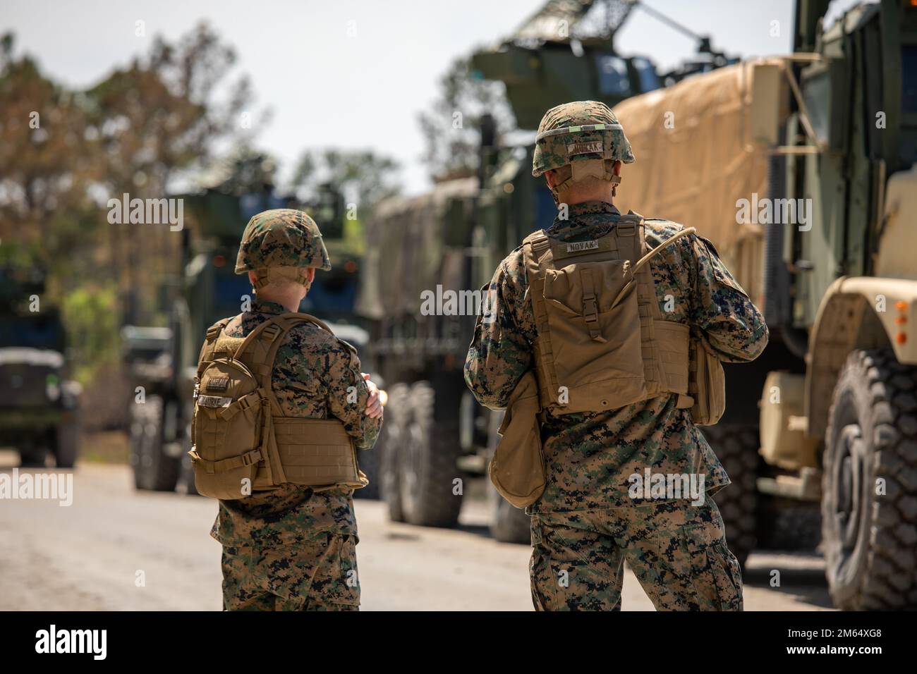 U.S. Marine Corps Col. Douglas R. Burke, center, commanding officer ...