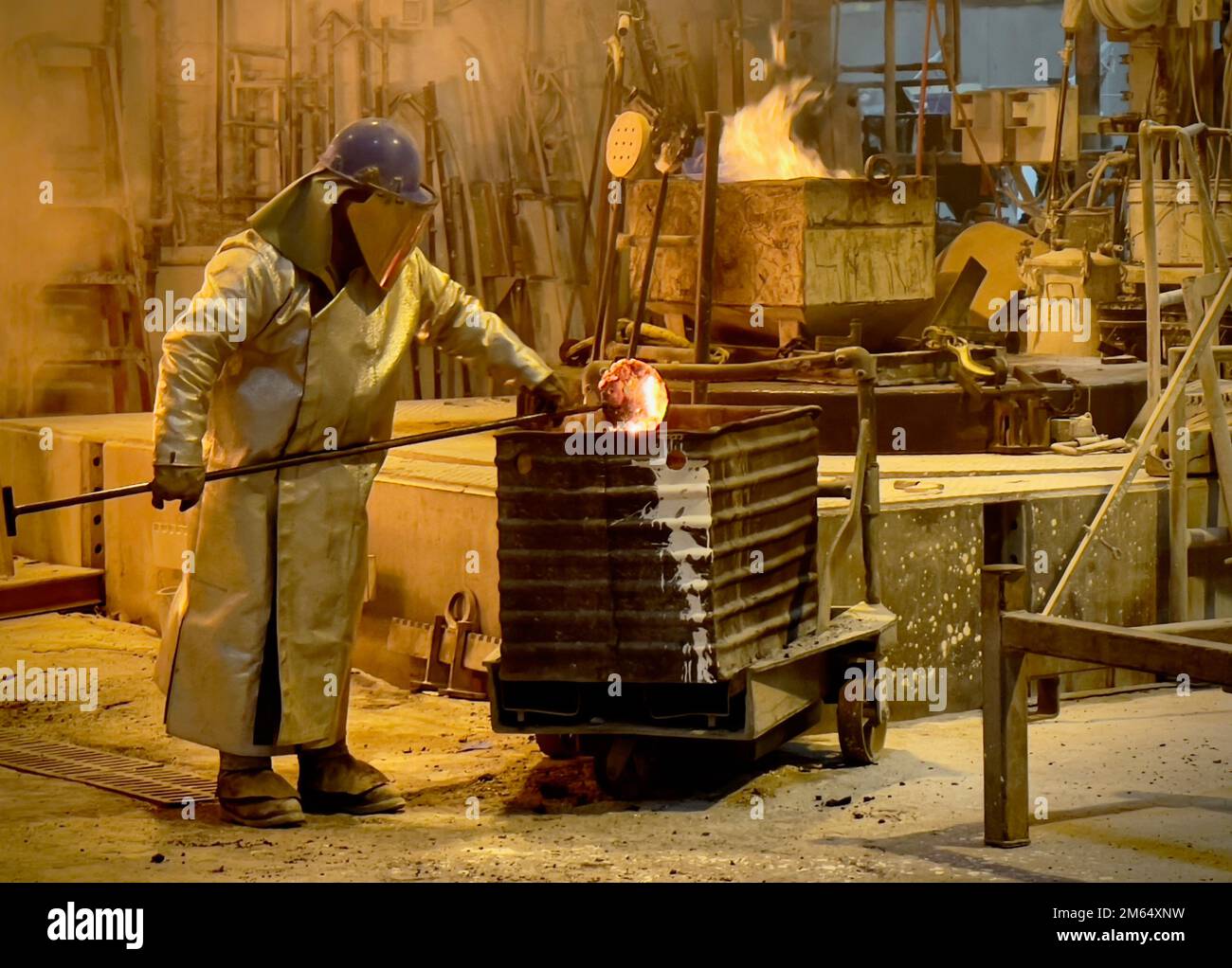 Foundry Artisan with slag-off from melting steel. MetalTek ...
