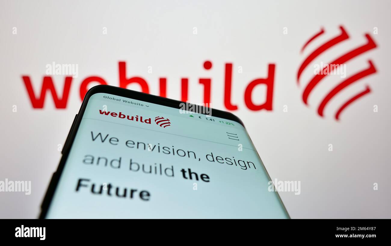 Smartphone with website of Italian construction company Webuild S.p.A ...