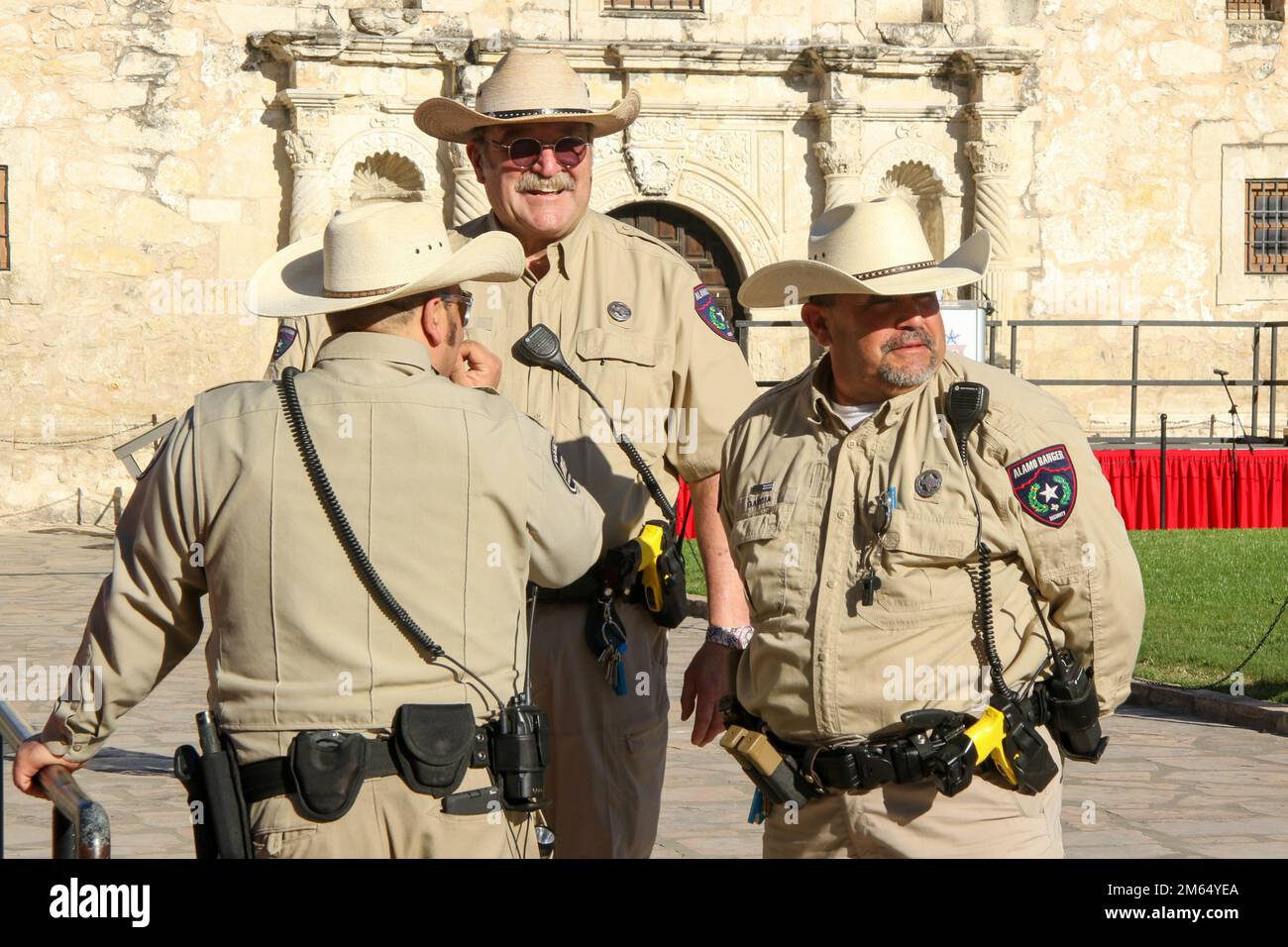 Alamo Rangers converse during the Investiture of King Antonio at the ...