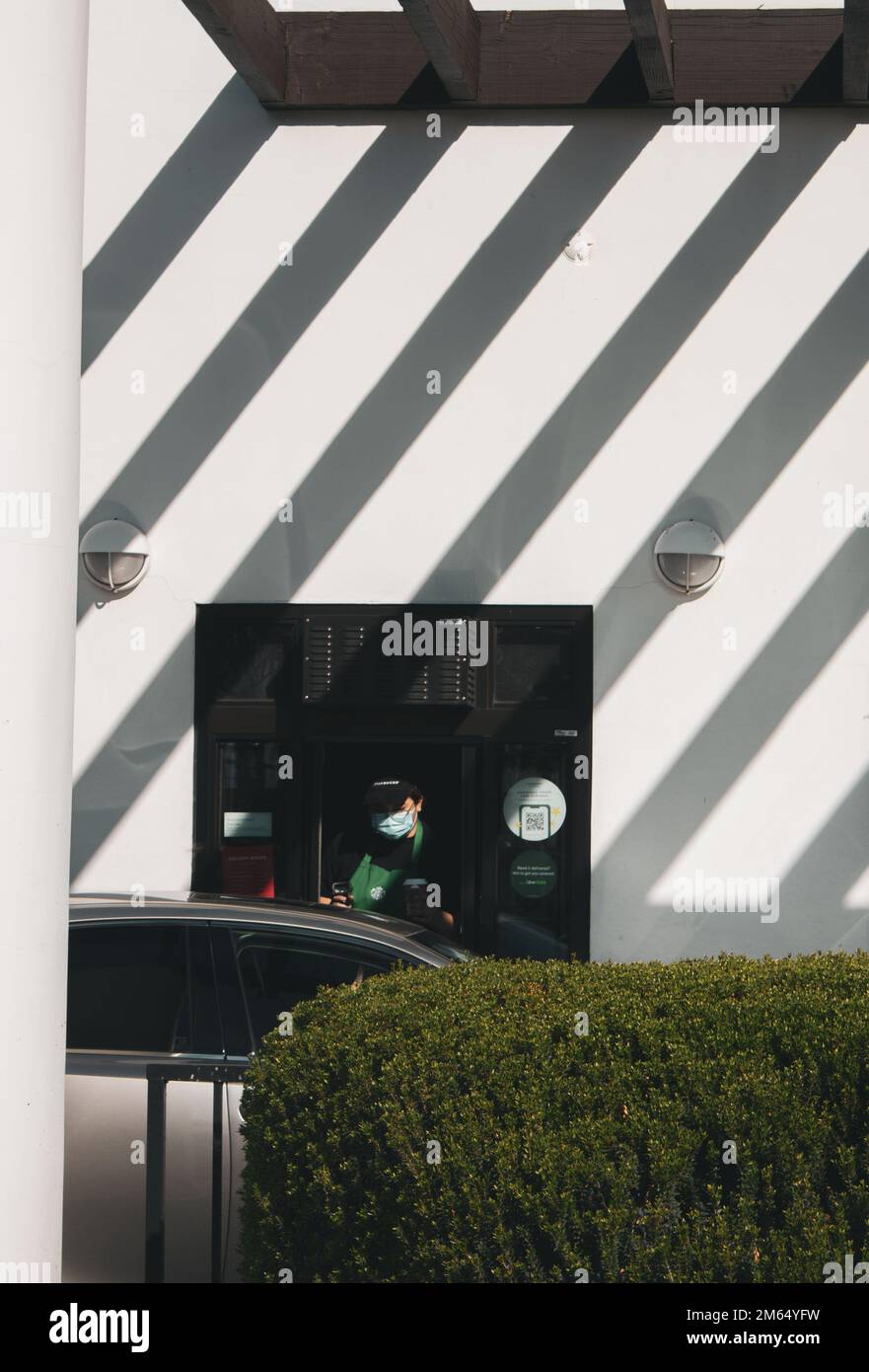 The smooth white walls of a fast food drive-through restaurant with ...