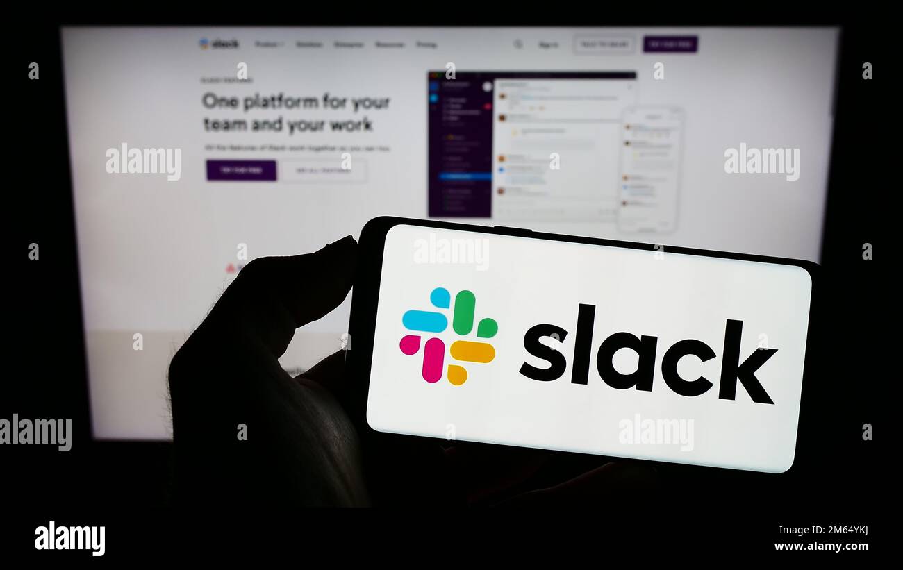 Person holding mobile phone with logo of American software company ...