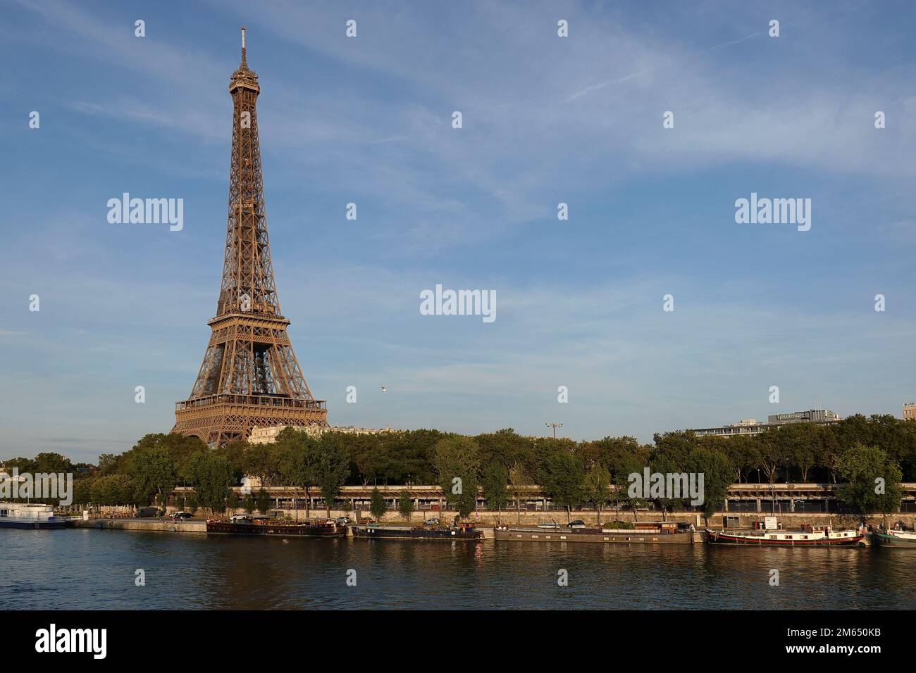 France, Paris, Boats anchored on the Seine river and view on Eiffel ...
