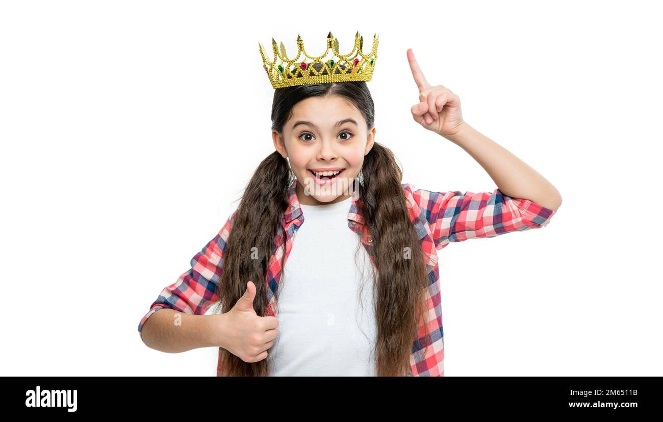 teen girl in crown on background, point finger. photo of teen girl in ...