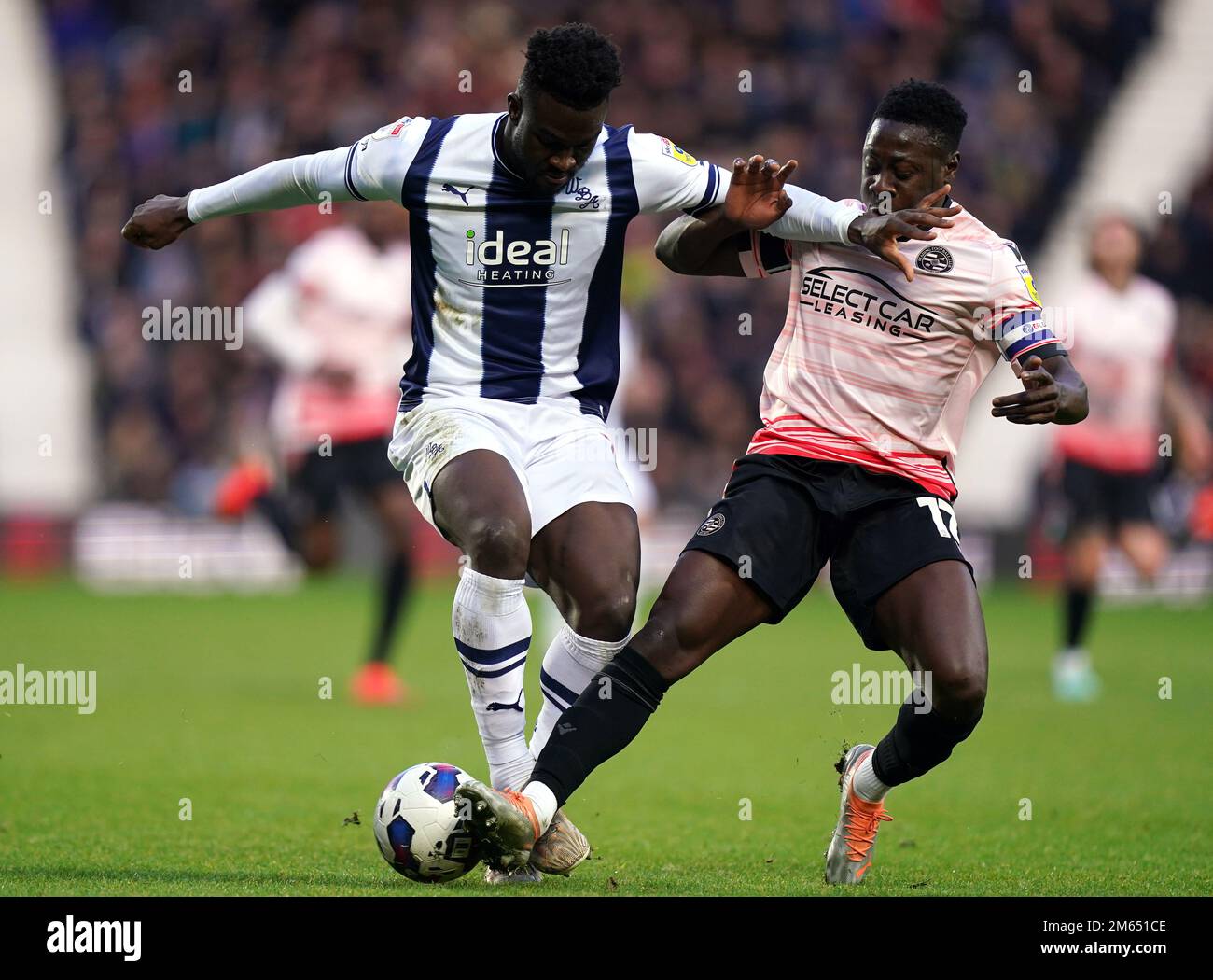 West Bromwich Albion's Daryl Dike (left) and Reading's Andy Yiadom ...