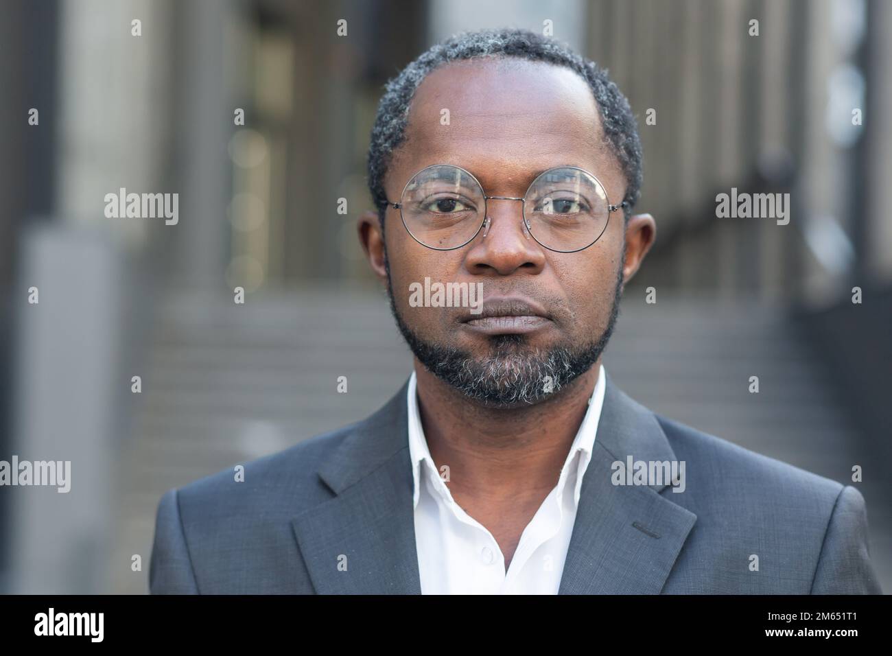 Close up portrait of serious businessman, afro american man in business ...