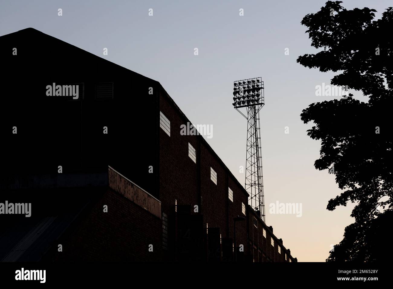Silhouette at sunset of Pittodrie the home of Aberdeen Football Club ...