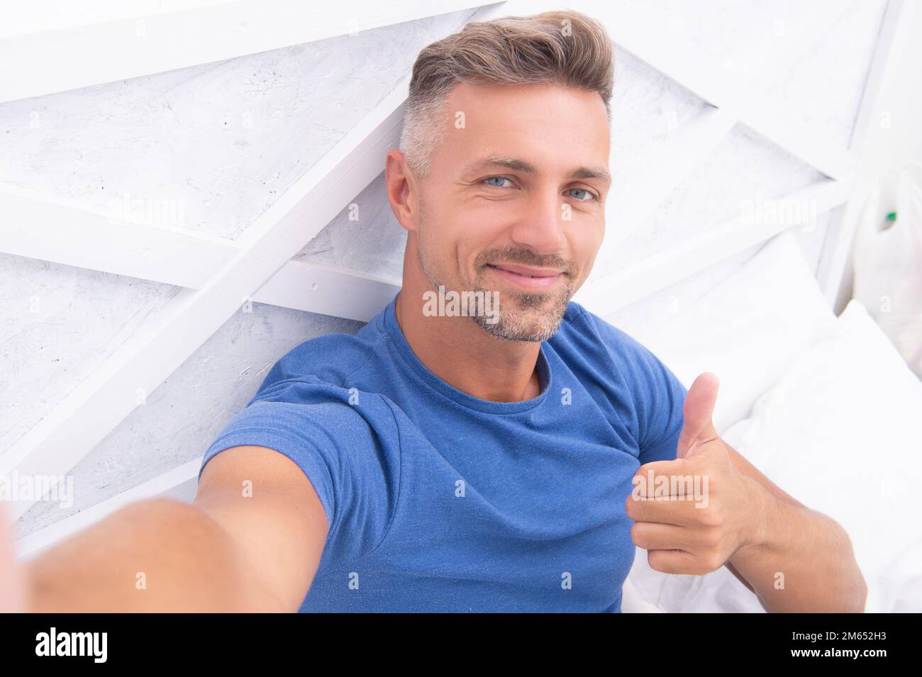 selfie man with phone wear shirt, thumb up. selfie man with phone in ...