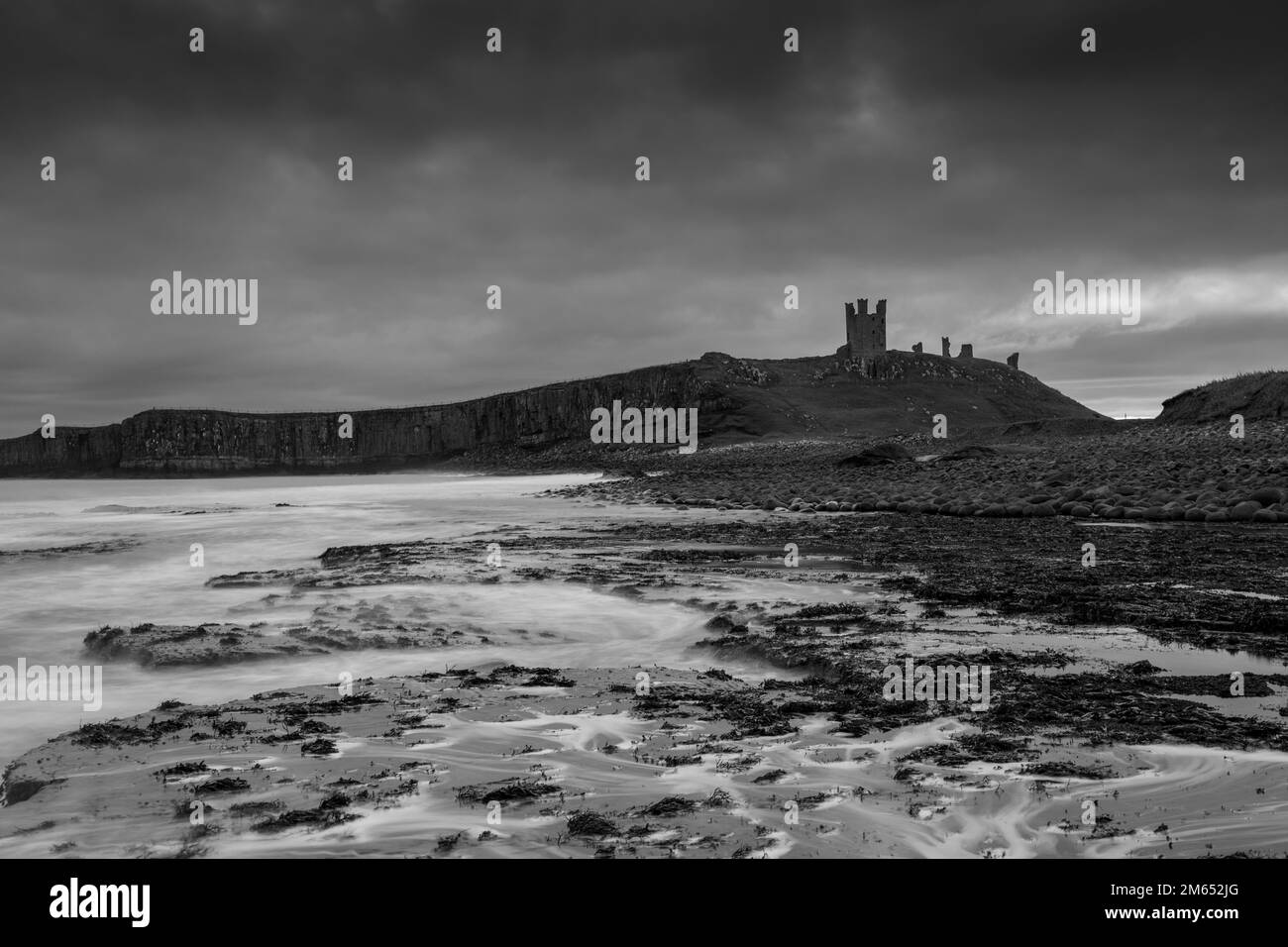 Dunstanburgh Castle sunrise, Northumberland Stock Photo - Alamy