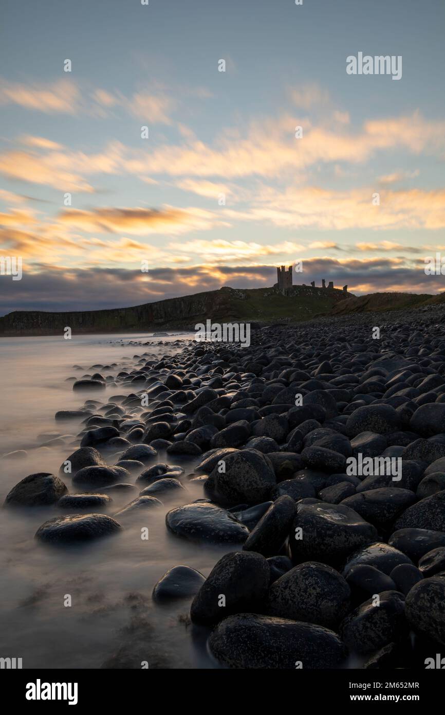 Dunstanburgh Castle sunrise, Northumberland Stock Photo - Alamy