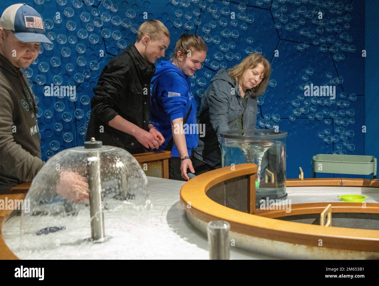 Jennifer Parmar, a Gold Star spouse, and her children play with an ...