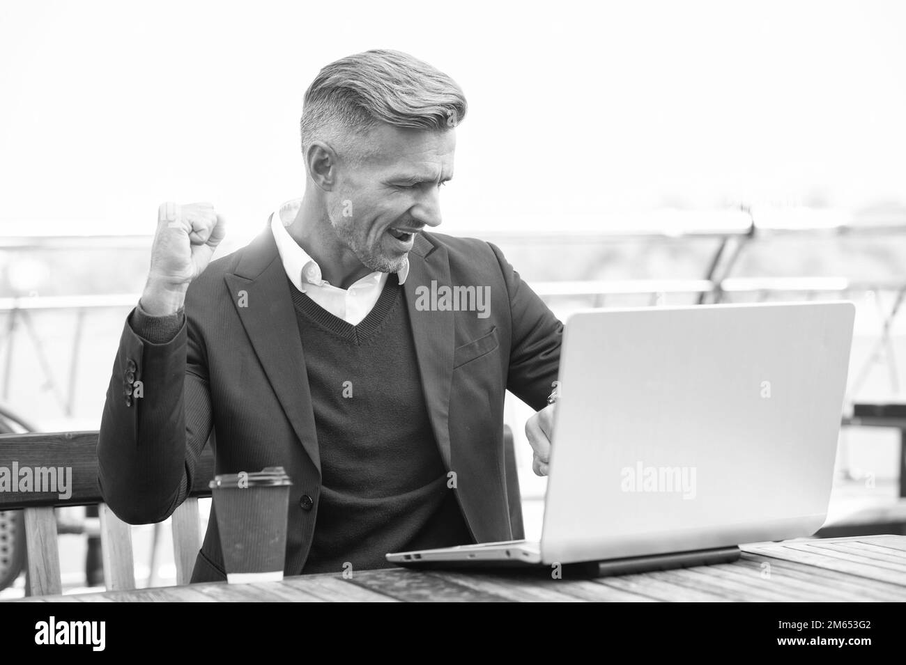 Got the job done in time. Happy man check watch and laptop. Punctuality ...