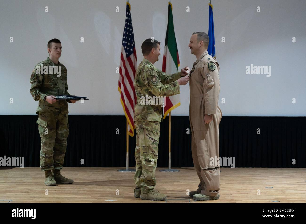 U.S. Air Force Col. Jason Barnes, center, commander of the 407th Air ...