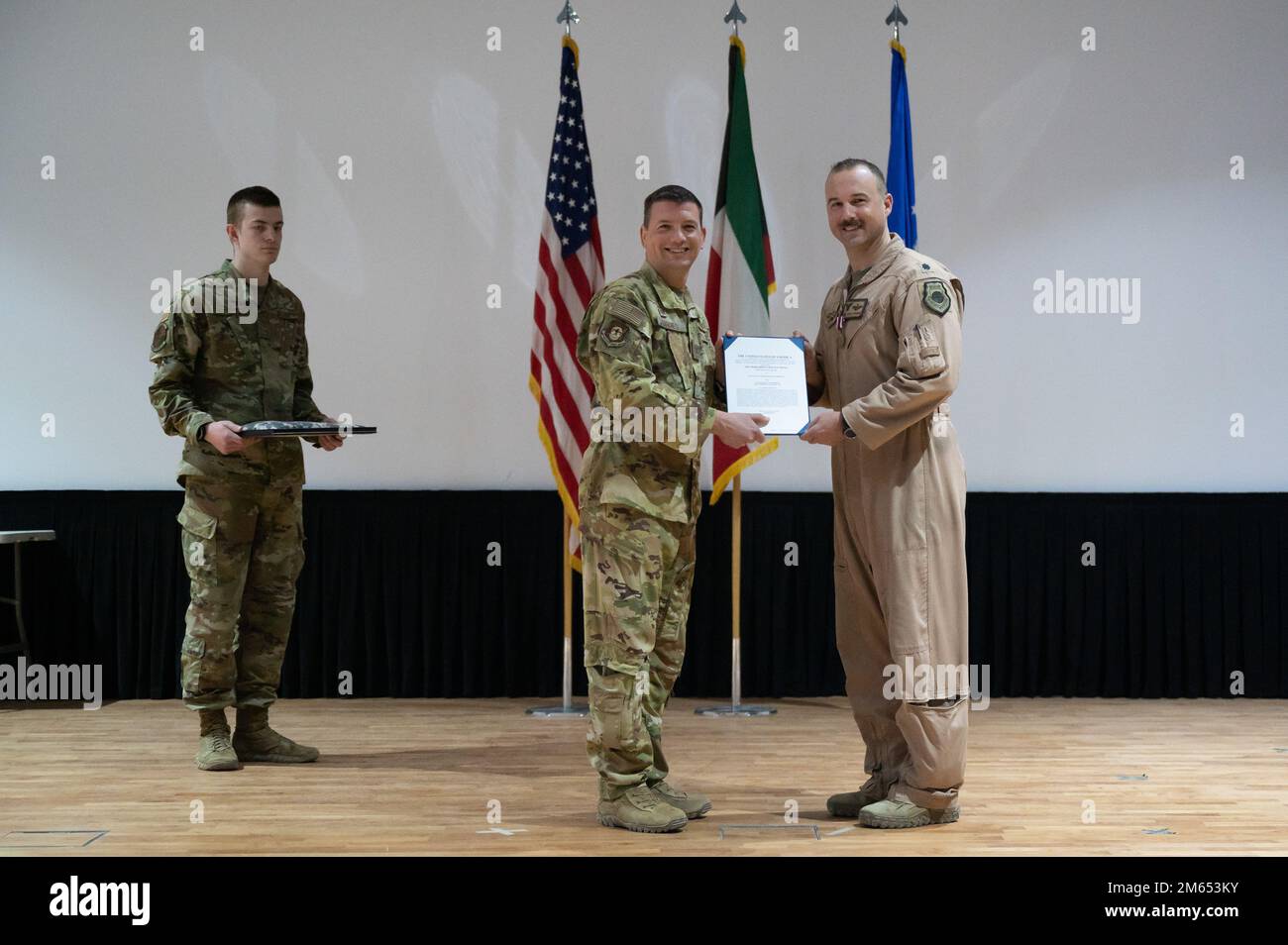 U.S. Air Force Col. Jason Barnes, center, commander of the 407th Air ...