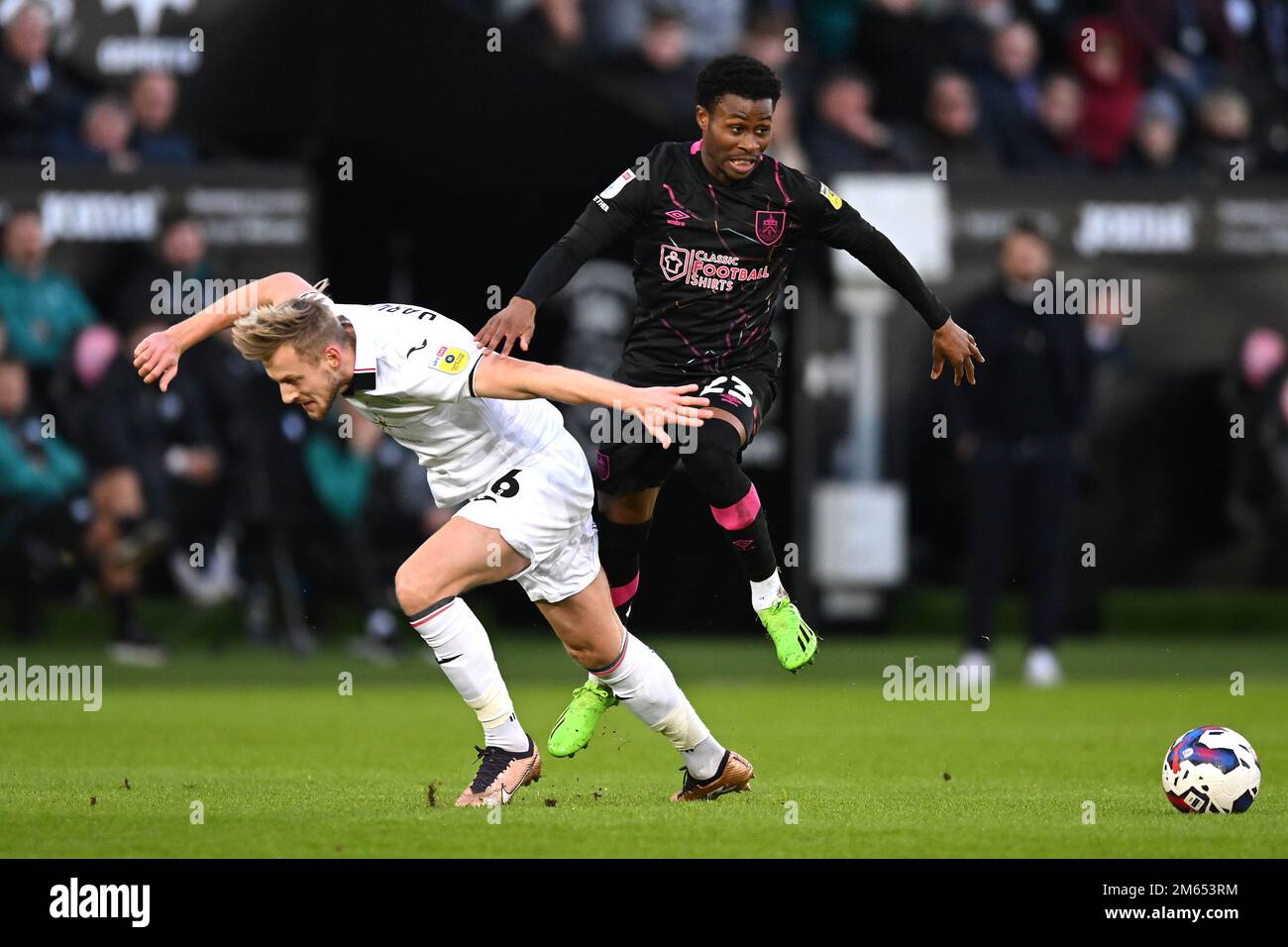Burnley's Nathan Tella (right) attempts to get past Swansea City's ...