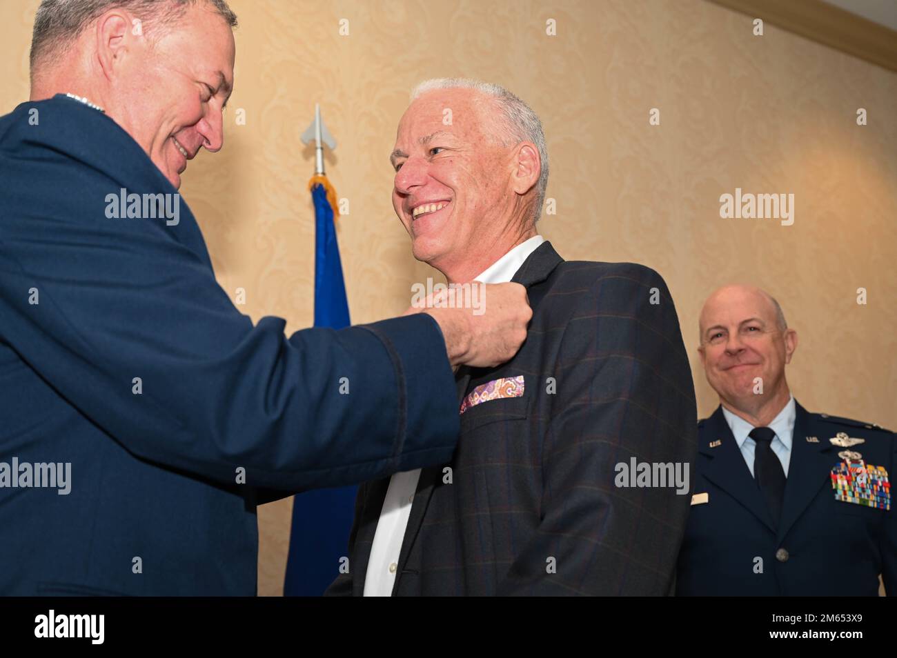 Tim Handren, City of Boerne mayor, receives an Air Force commander’s insignia pin from Col ...