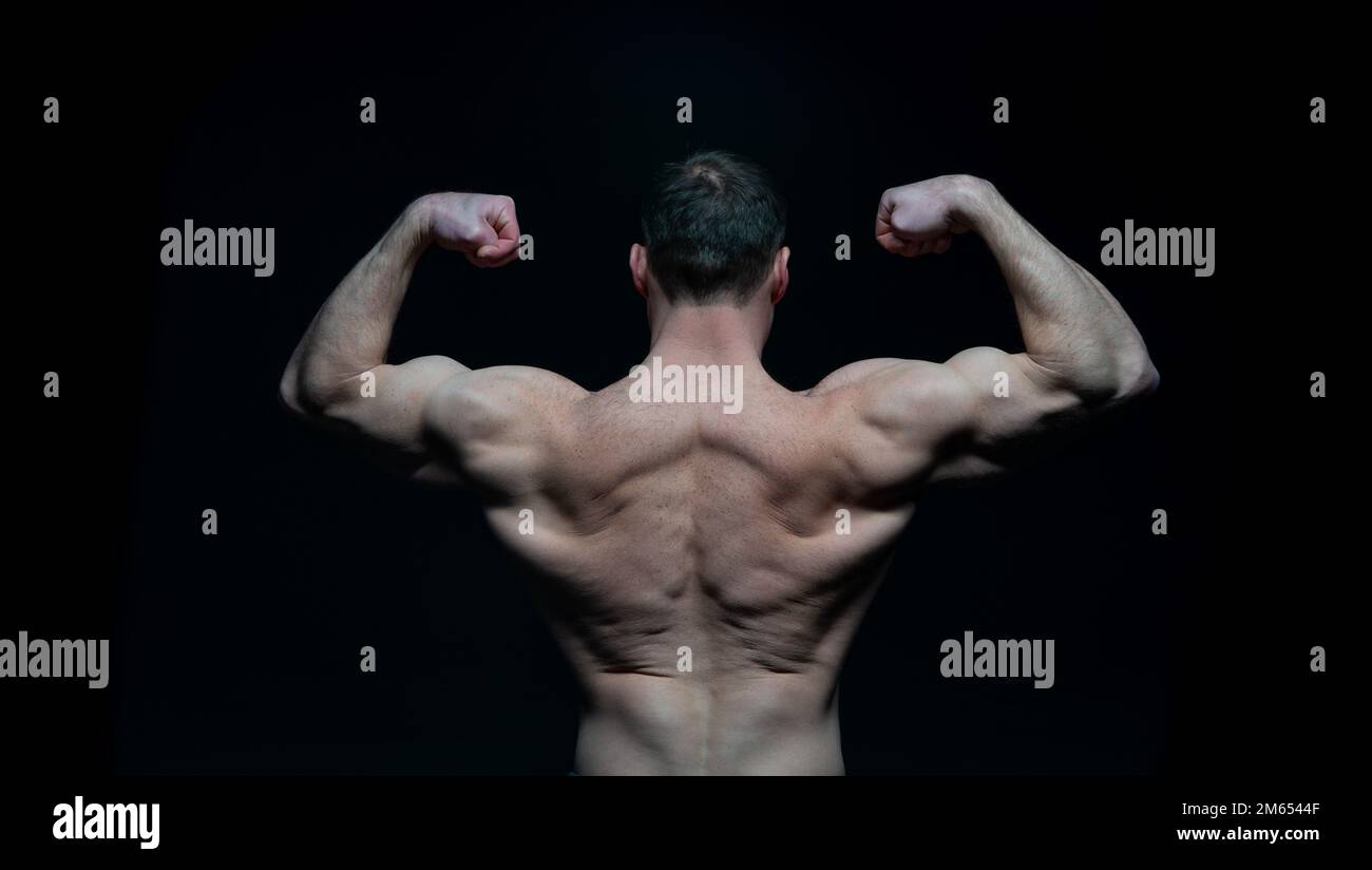 bodybuilder man muscular back isolated on black. bodybuilder man ...