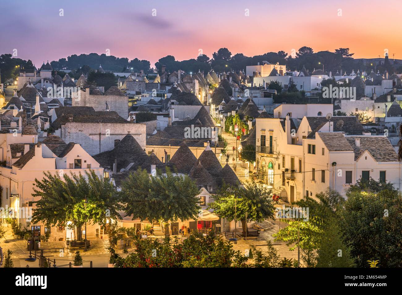 Alberobello, Italy with Trulli houses at dusk Stock Photo - Alamy