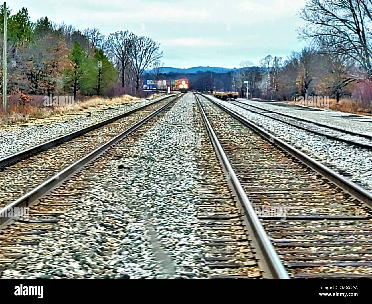 A commercial train rumbles down the tracks April 2, 2022, at Fort McCoy ...