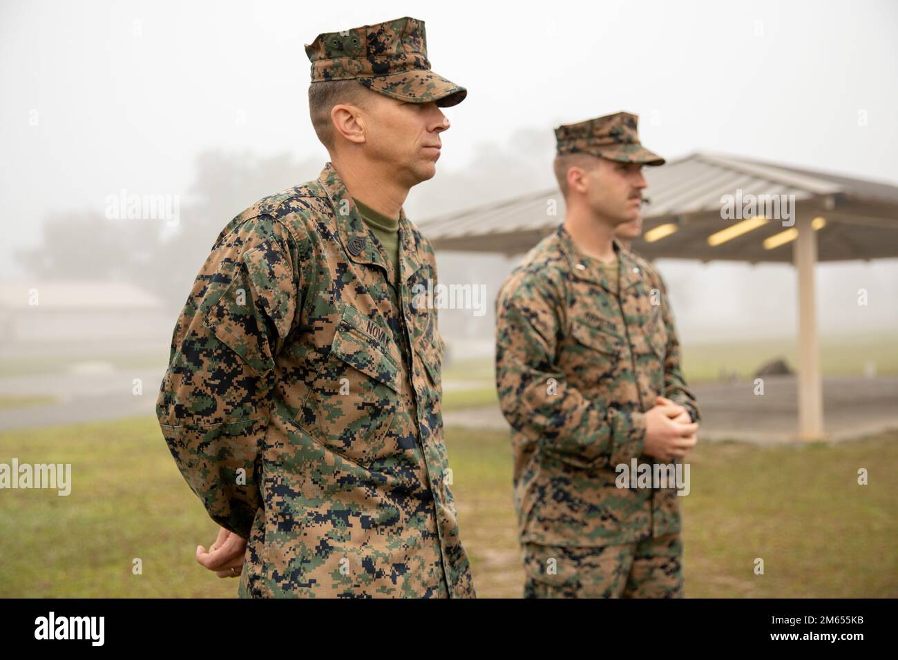 U.S. Marine Corps Sgt. Maj. Jonathan E. Novak, left, sergeant major of ...