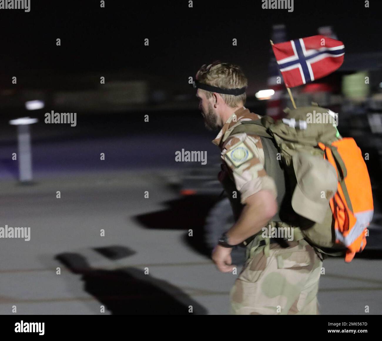 A member of the Norwegian Army’s Task Force Viking runs across the ...