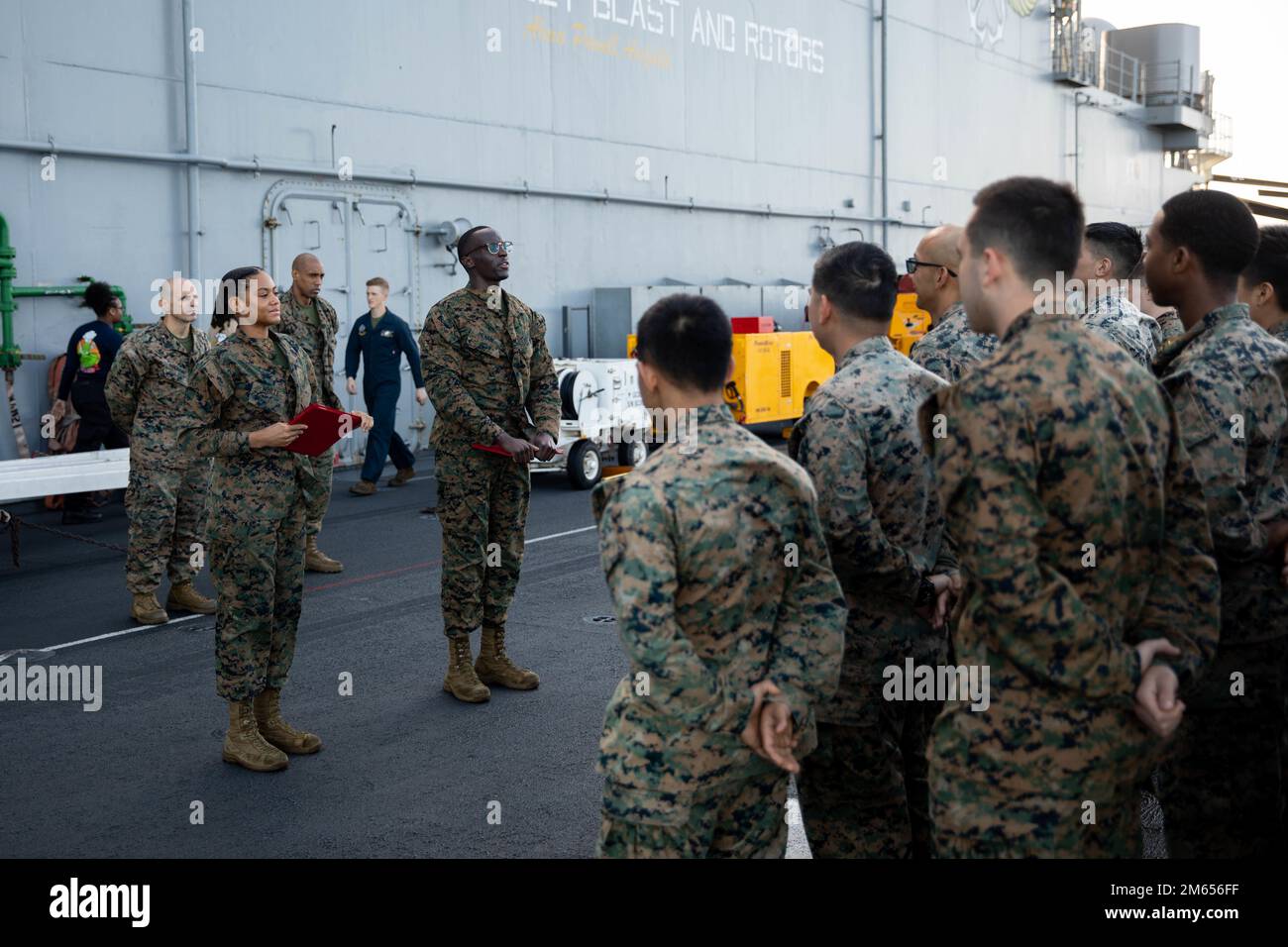 U.S. Marine Corps Cpl. Symone White, a network administrator, left, and ...