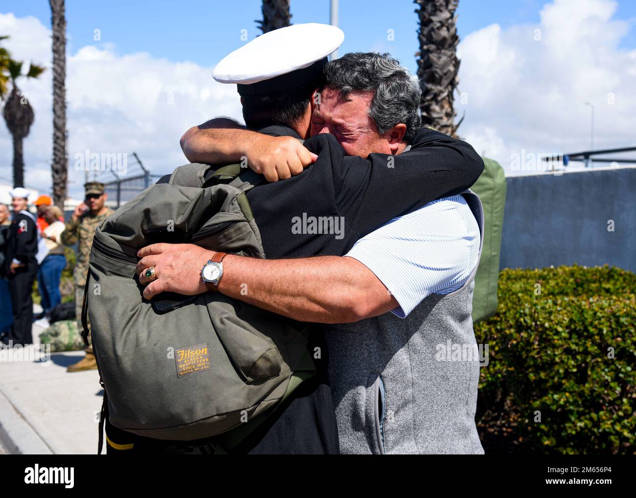 SAN DIEGO (March 4, 2022) Ensign Jack Pollard, from Baltimore, hugs his ...