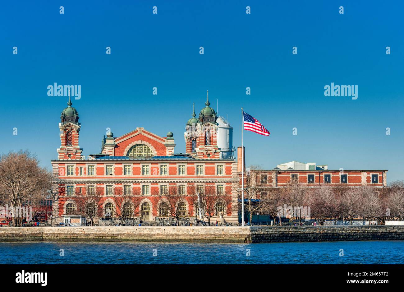 Museum on Liberty Island. USA. Waving USA Flag Stock Photo - Alamy