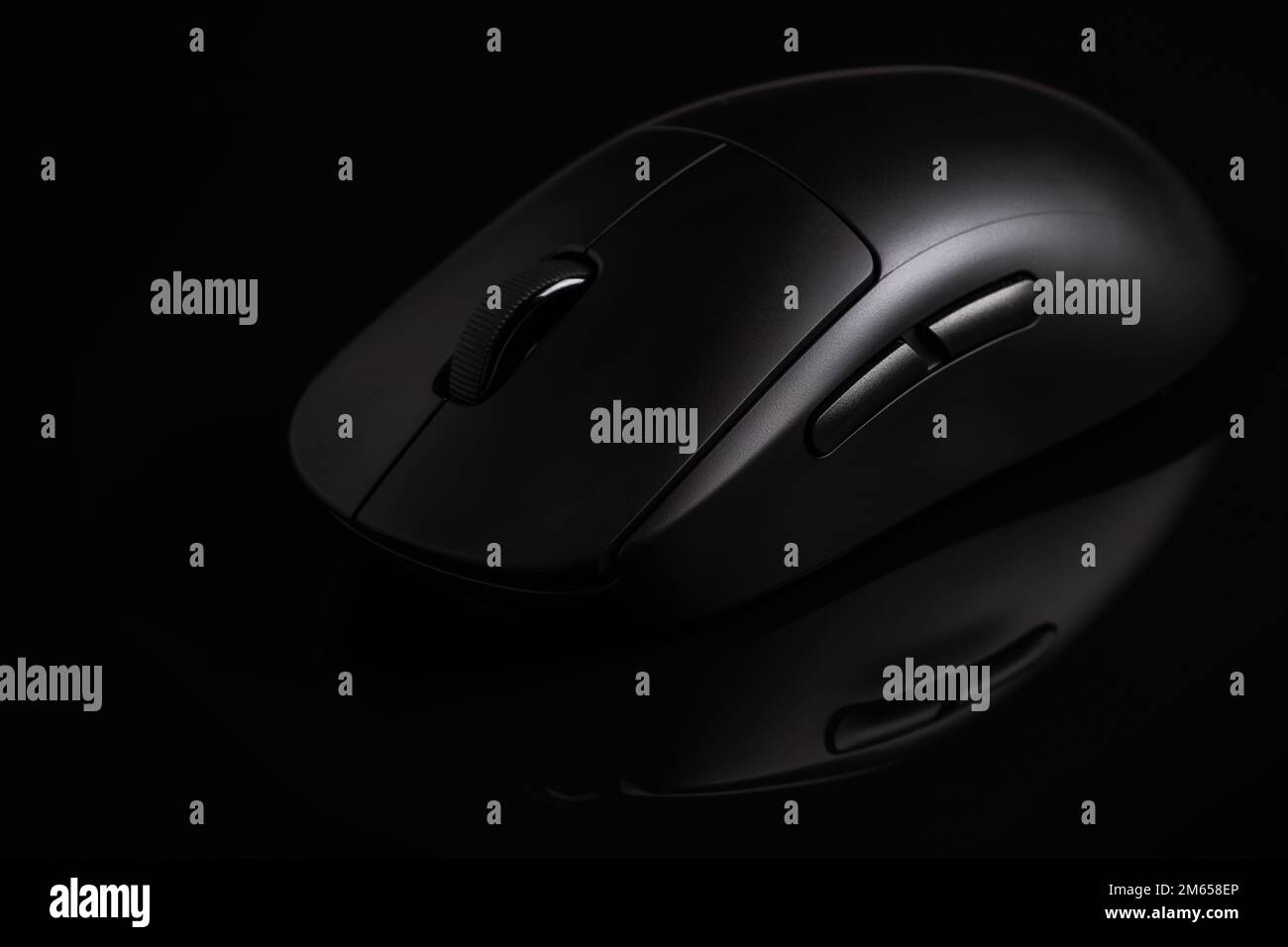 Black modern wireless computer mouse on black background Stock Photo ...