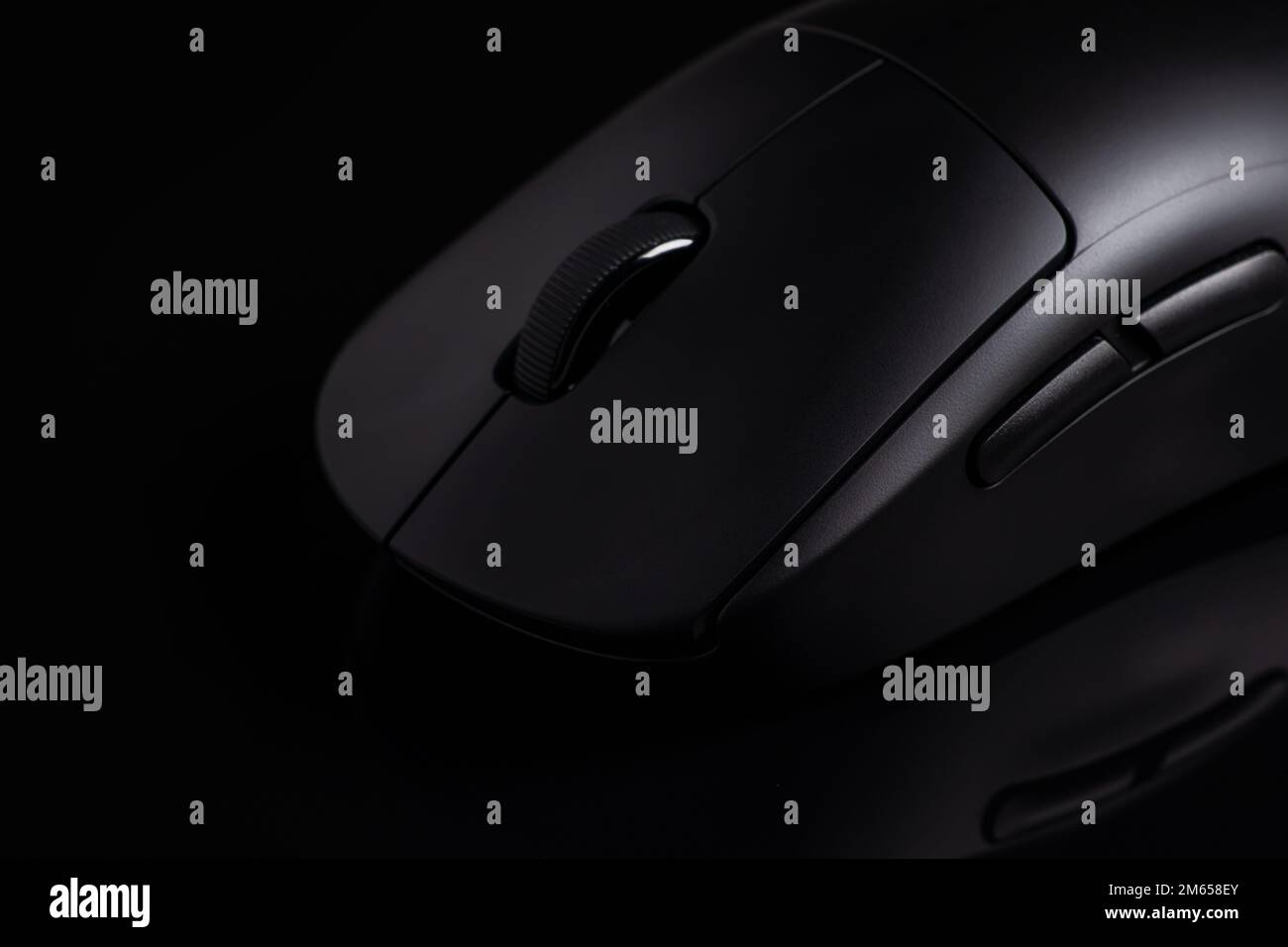 Black modern wireless computer mouse on black background Stock Photo ...