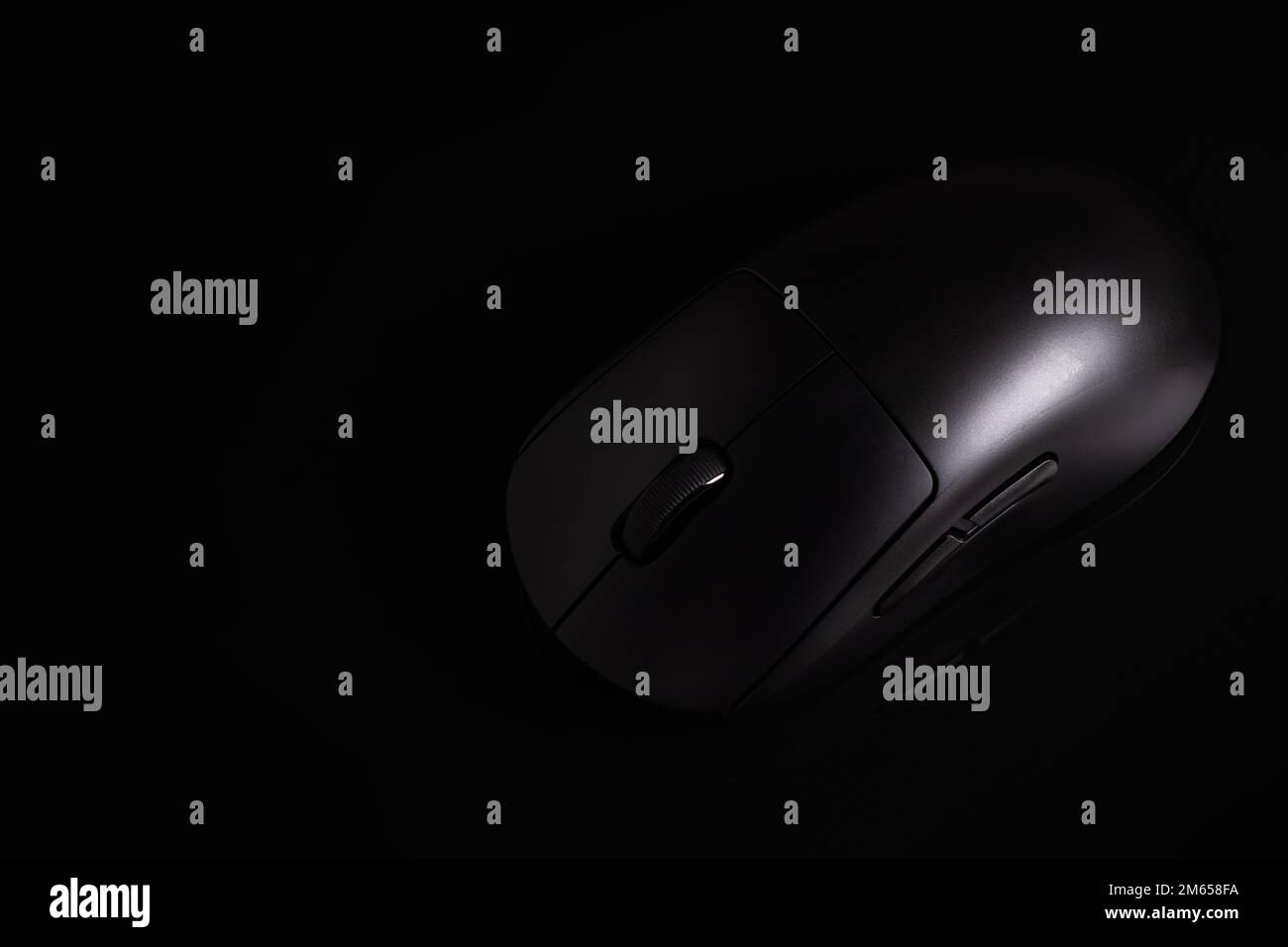 Black modern wireless computer mouse on black background Stock Photo ...