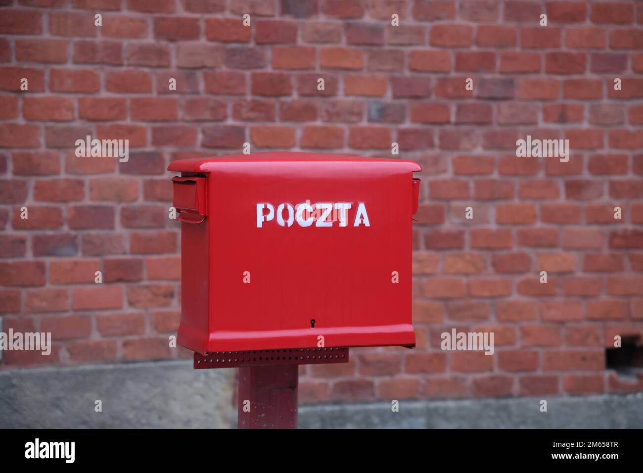 Traditional red mailbox with Polish text "Poczta Stock Photo - Alamy
