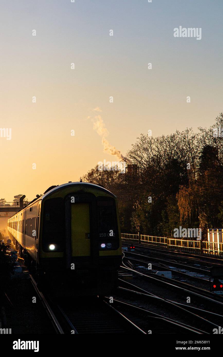 A South Western train approaches Woking station during a period of ...