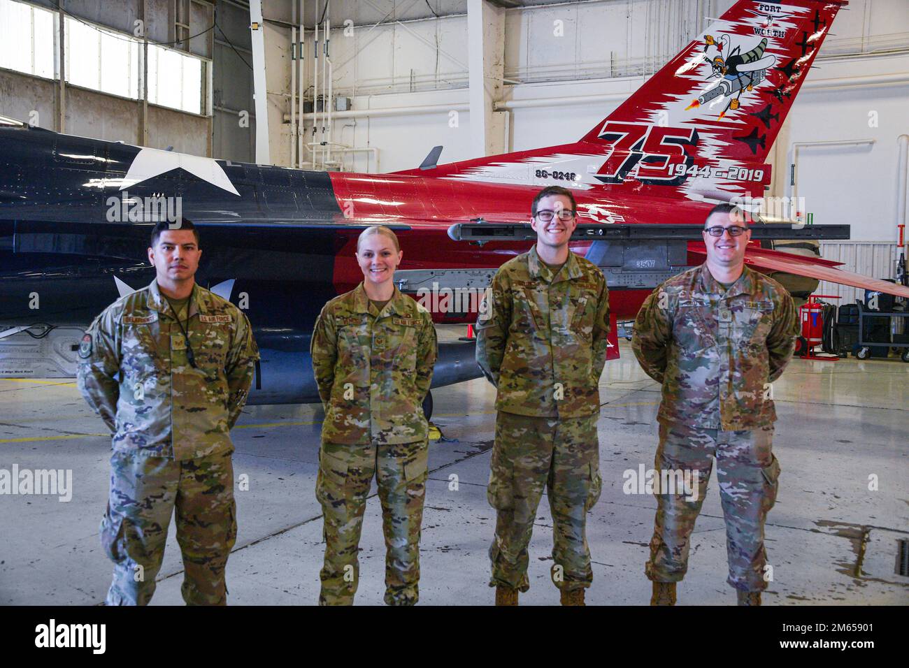 Members from the 301st Fighter Wing pose in front of the 75th year ...