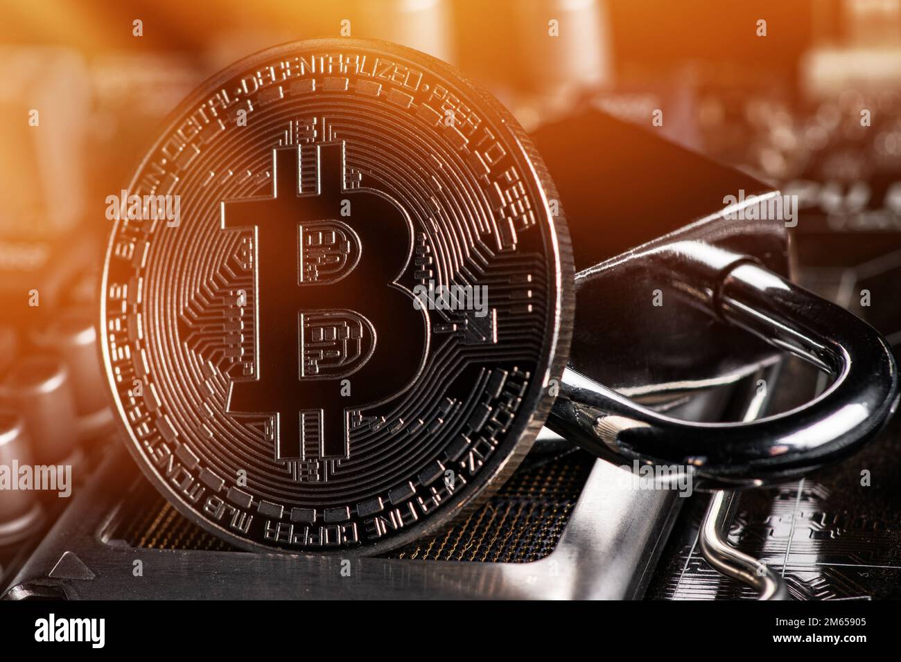 Bitcoin with locker on motherboard. Cryptocurrency law. Digital ...