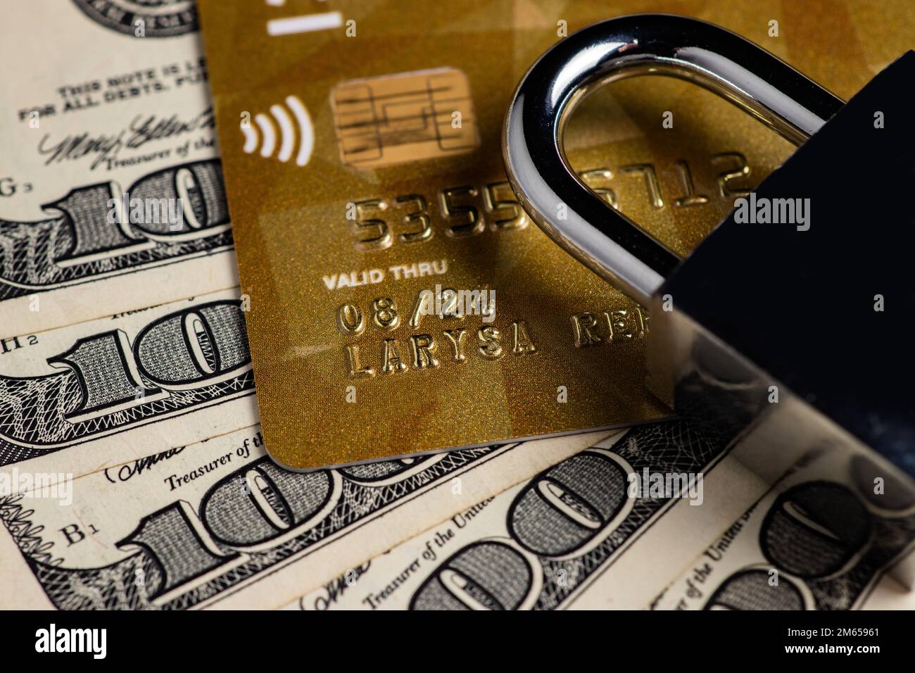 Padlock and credit card on money. Payment security concept using a bank ...