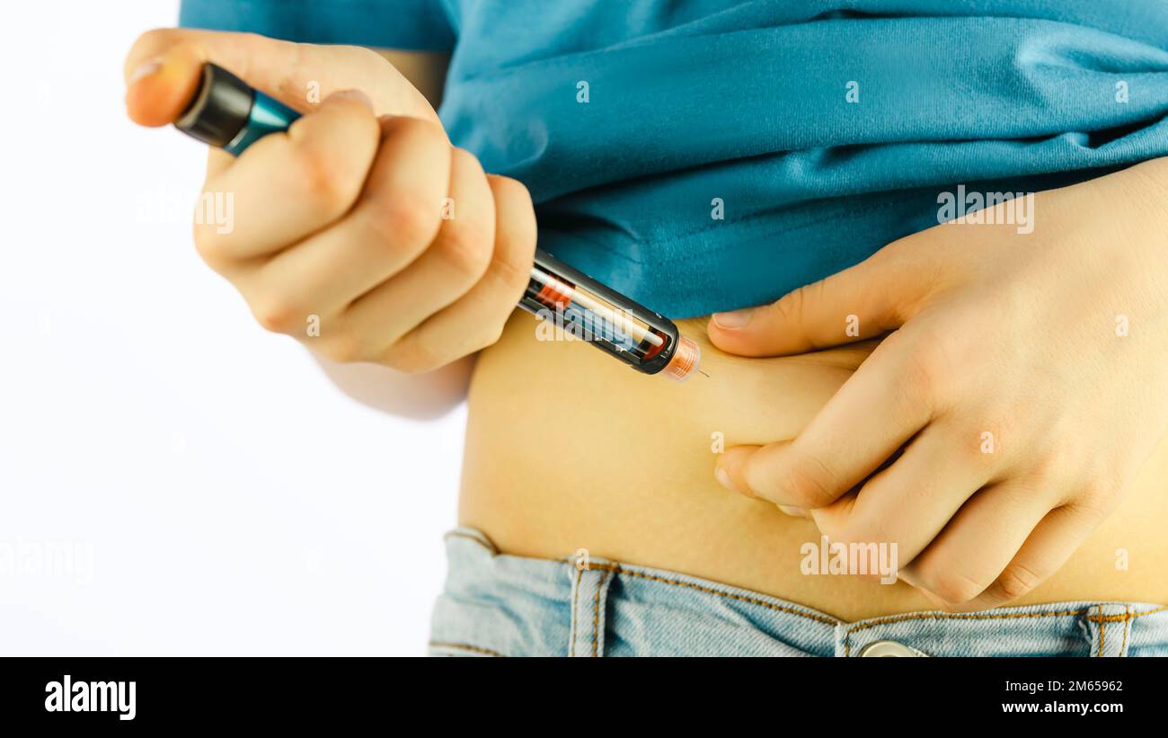 Boy with diabetes makes an insulin injection into the belly himself ...