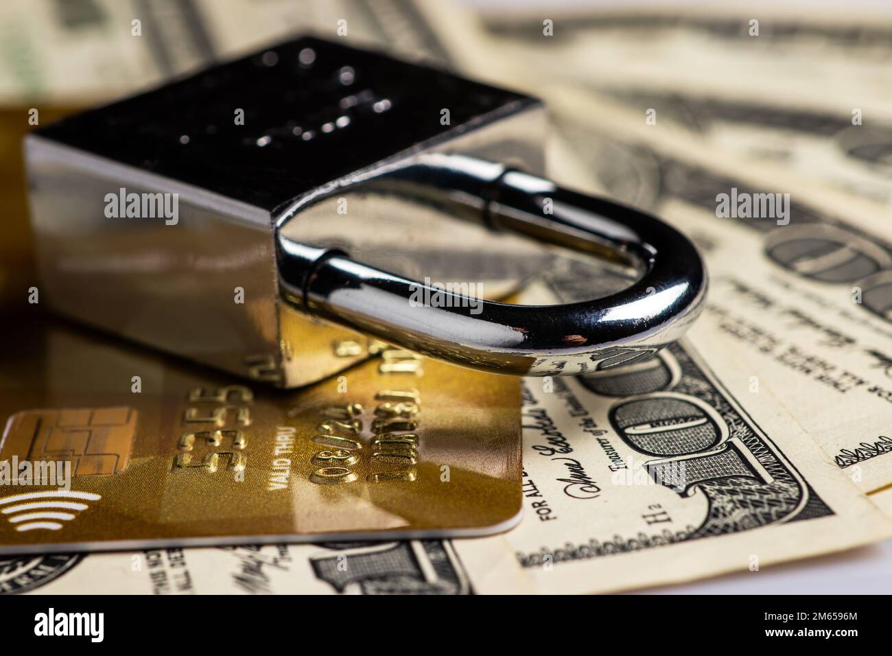 Padlock and credit card on money. Payment security concept using a bank ...