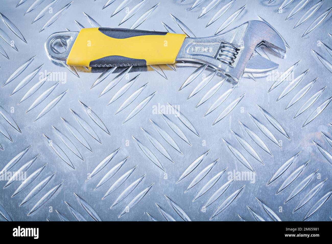 Adjustable wrench on fluted metal sheet construction concept Stock ...