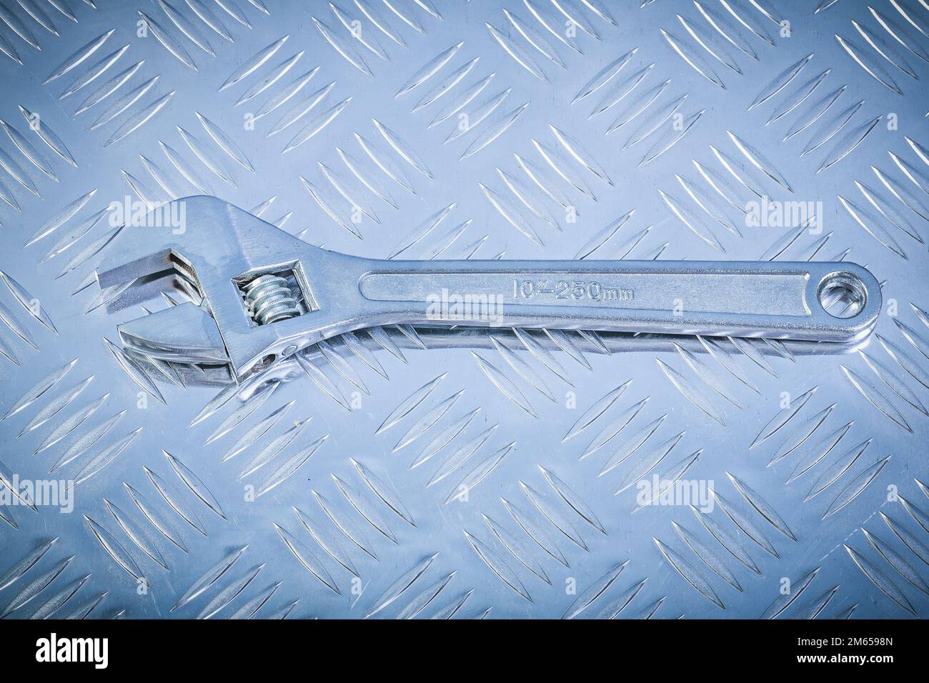 Adjustable wrench on fluted metal sheet construction concept Stock ...