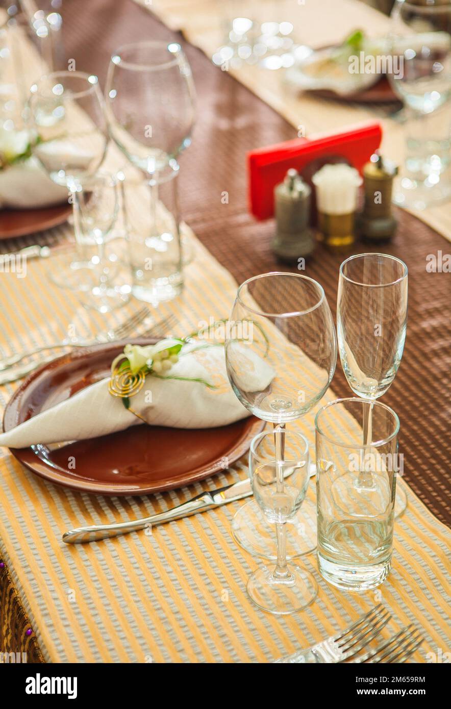 empty kitchen glassware on dinner table Stock Photo - Alamy