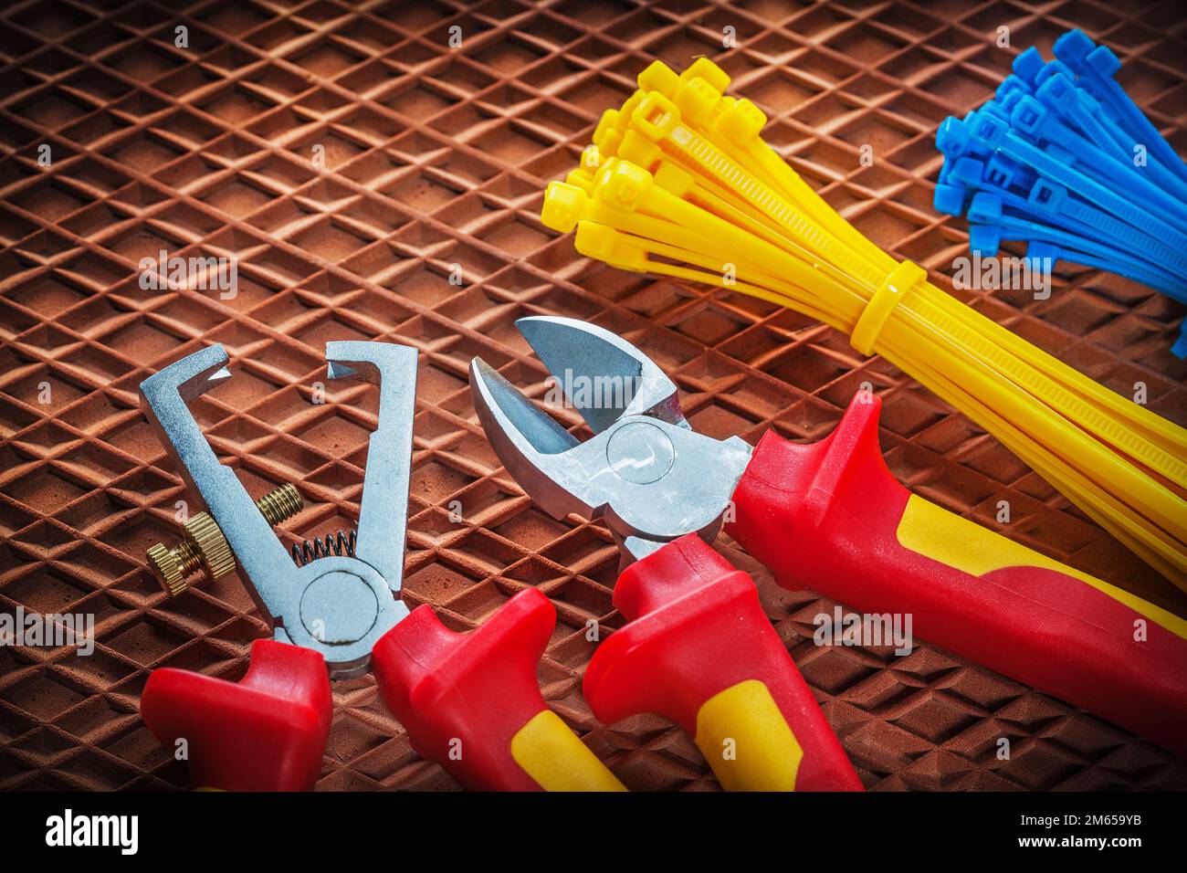 Insulation wire strippers cutter tying cables on dielectric mat Stock ...
