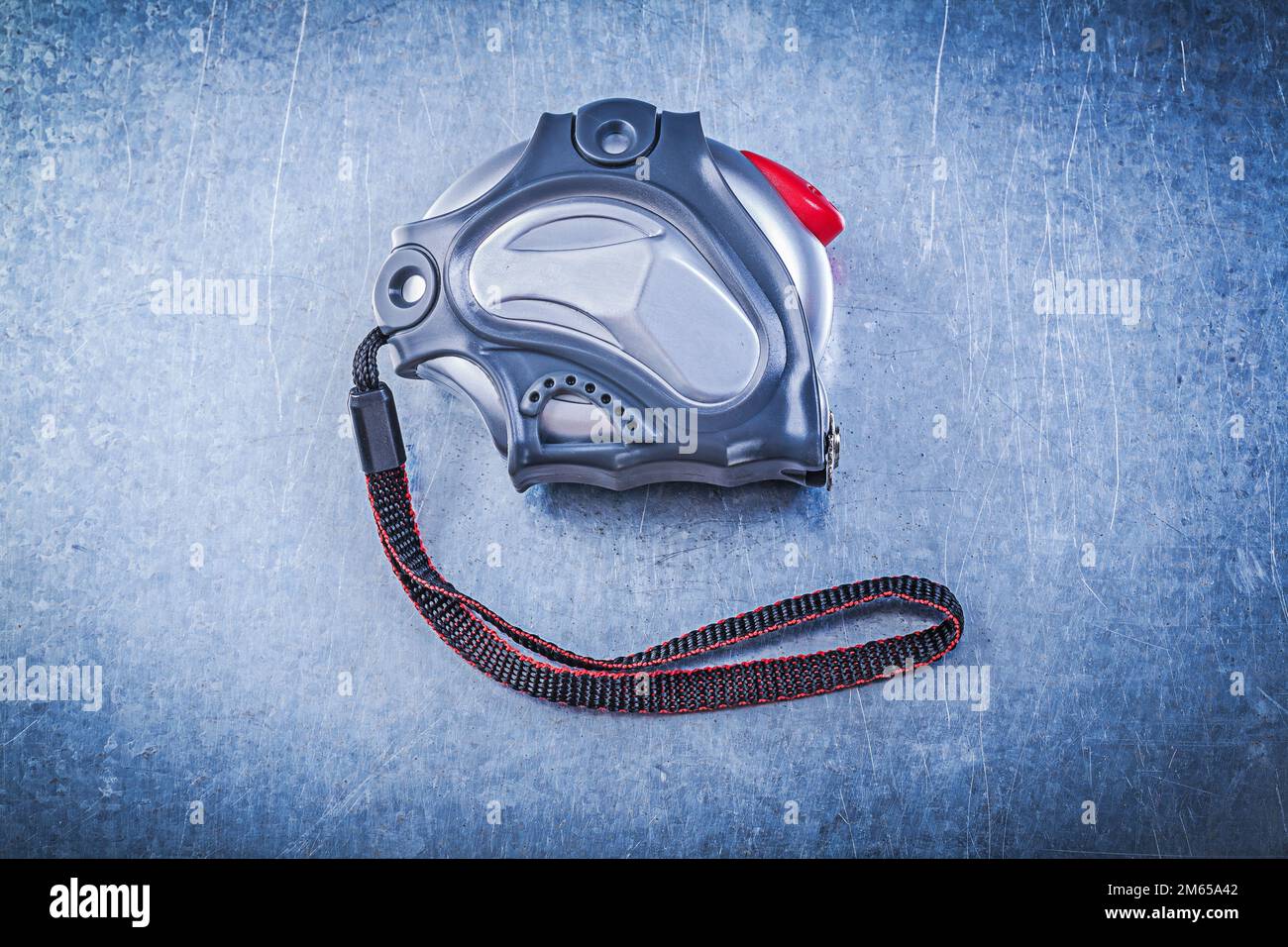 Measuring tape on scratched metallic background construction concept ...