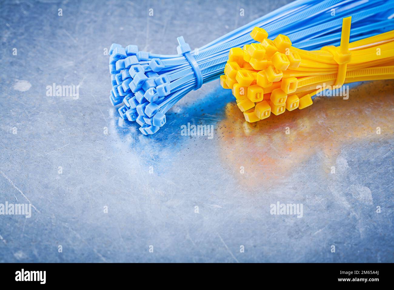 Plastic self-locking tying cables on metallic background construction ...