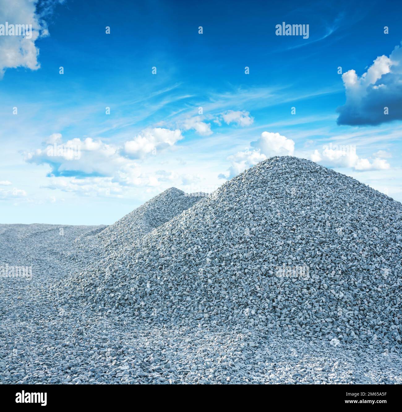 pile of granite gravel on background of the sky Stock Photo - Alamy