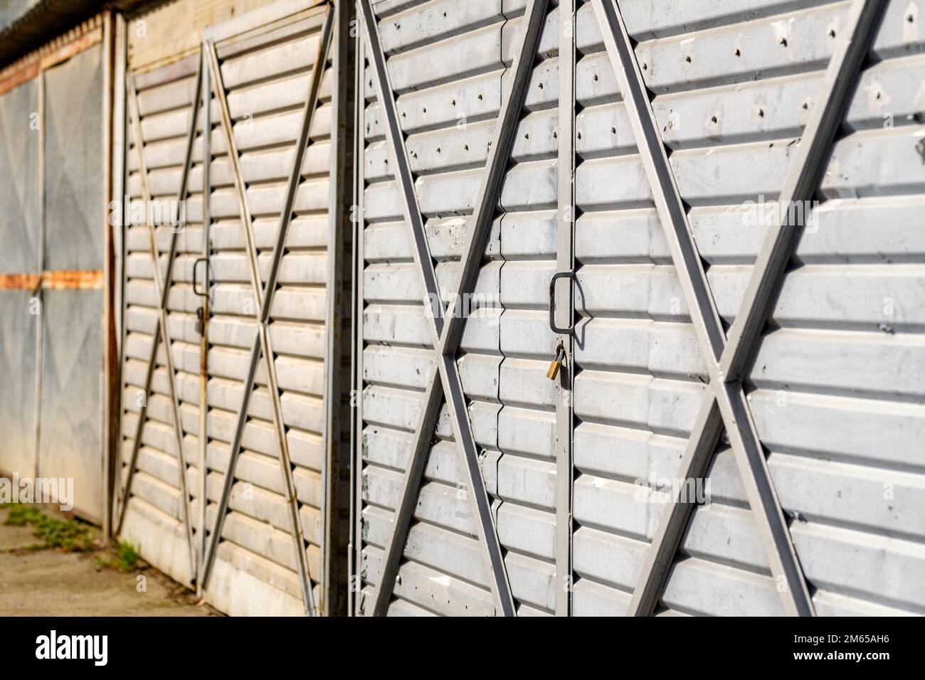 Old metal garage sheds with locked doors, selective focus Stock Photo ...