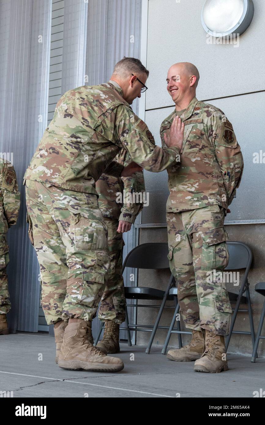 Tech. Sgt. Thomas Siler pins the Technical Sergeant rank onto newly ...
