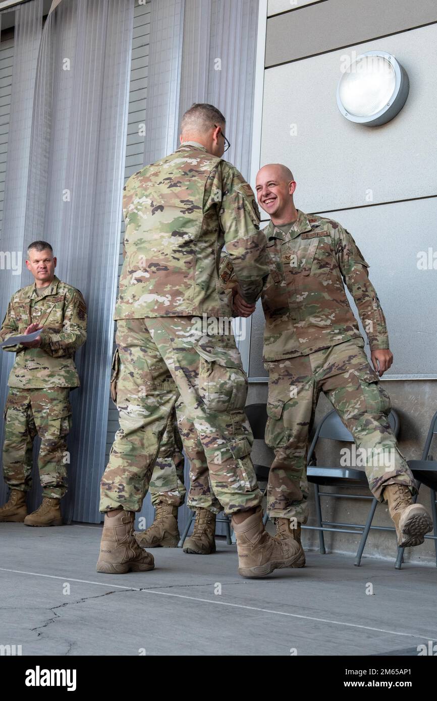 Tech. Sgt. Thomas Siler shakes newly promoted Tech. Sgt. Eric Terry's ...