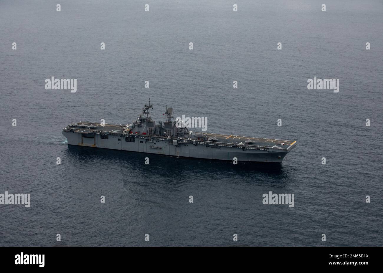U.S. Navy amphibious assault ship USS Tripoli (LHA 7) operates off the ...