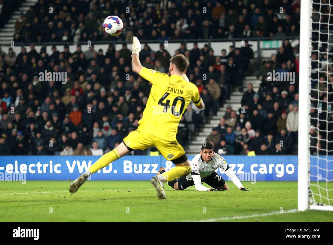 Derby County's William Osula (right) sees his shot saved by Accrington ...